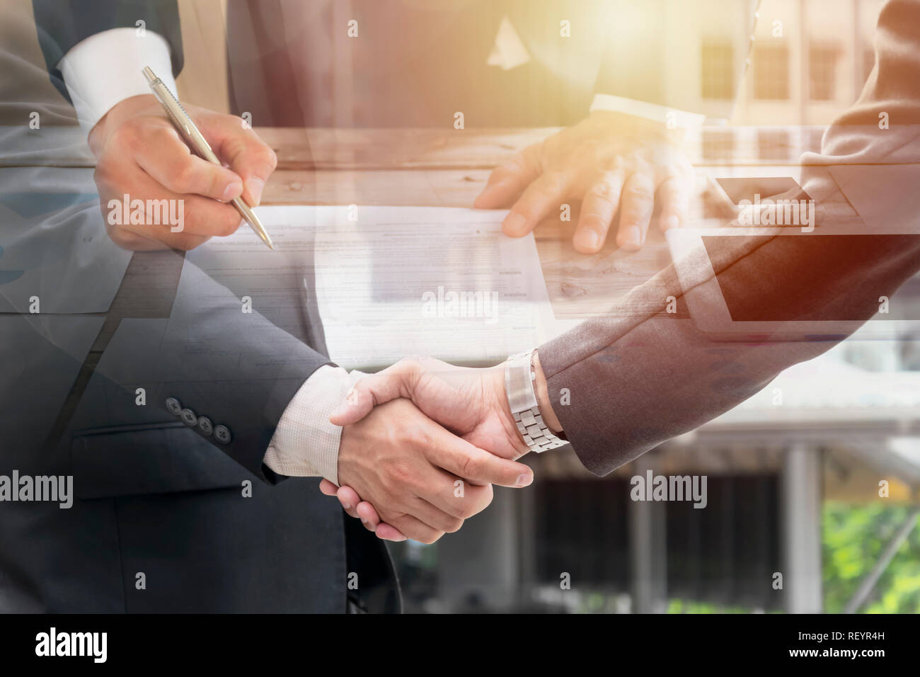 Business man signing contract making a deal and Shake hands to invest ...