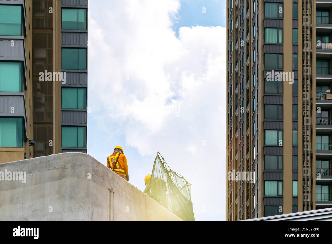 Engineers who are overseeing the construction work. The background is a ...