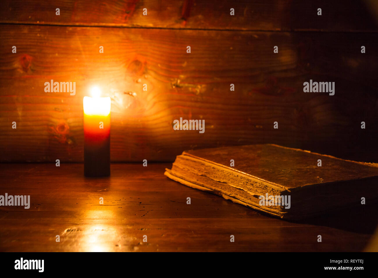 Reading scene in ancient times: an old book leaning on ruined wooden ...