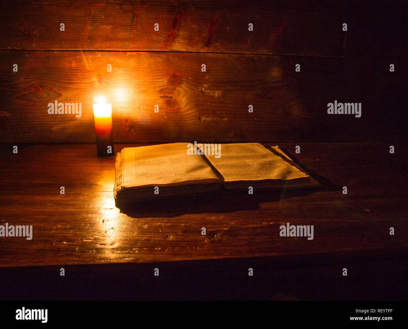 Reading scene in ancient times: an old book leaning on ruined wooden ...