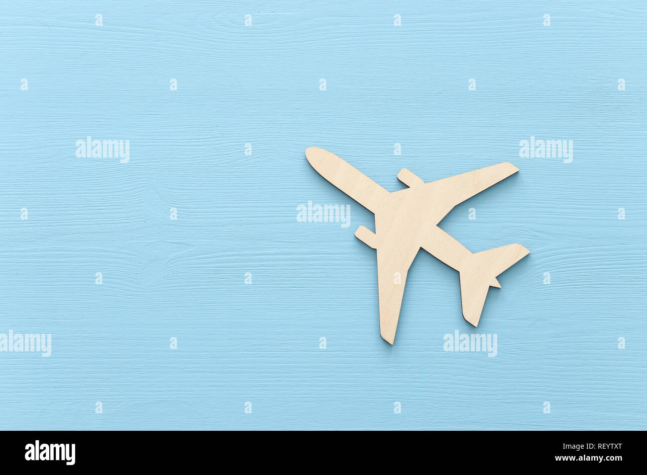 top view photo of wooden airplane over blue background Stock Photo - Alamy