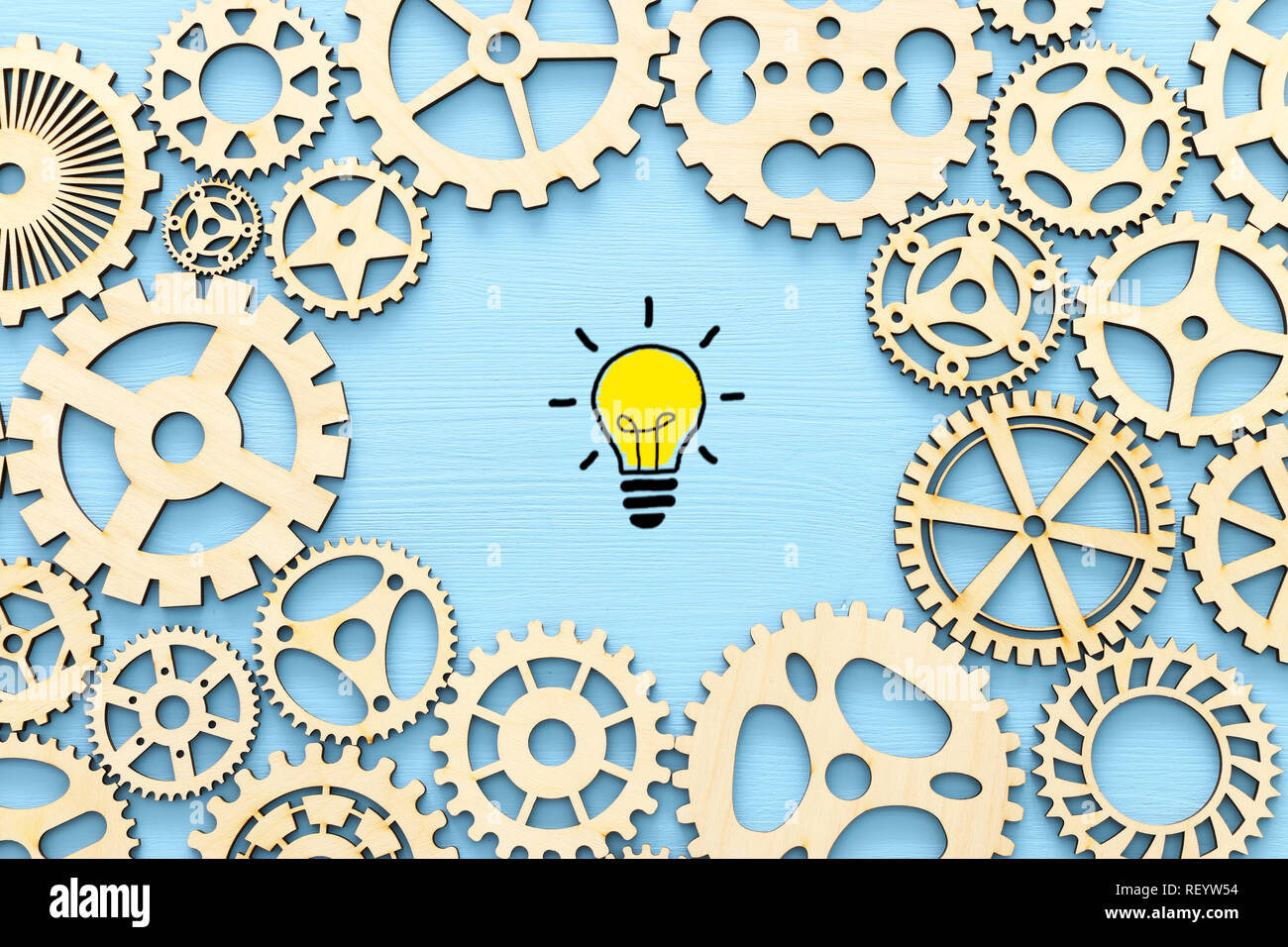 hand placing a cogwheel in set of gears mechanism Stock Photo - Alamy