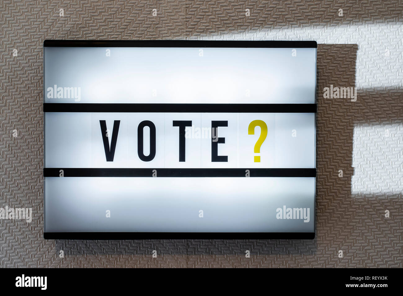 Message Vote on illuminated board. Voting question concept with text ...