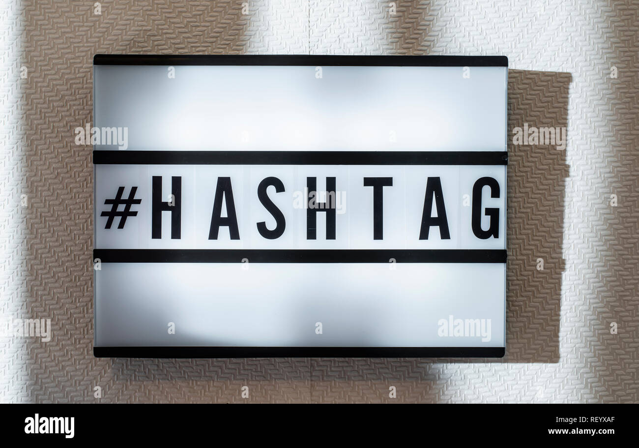 Message #Hashtag on illuminated board. Identify message concept with ...