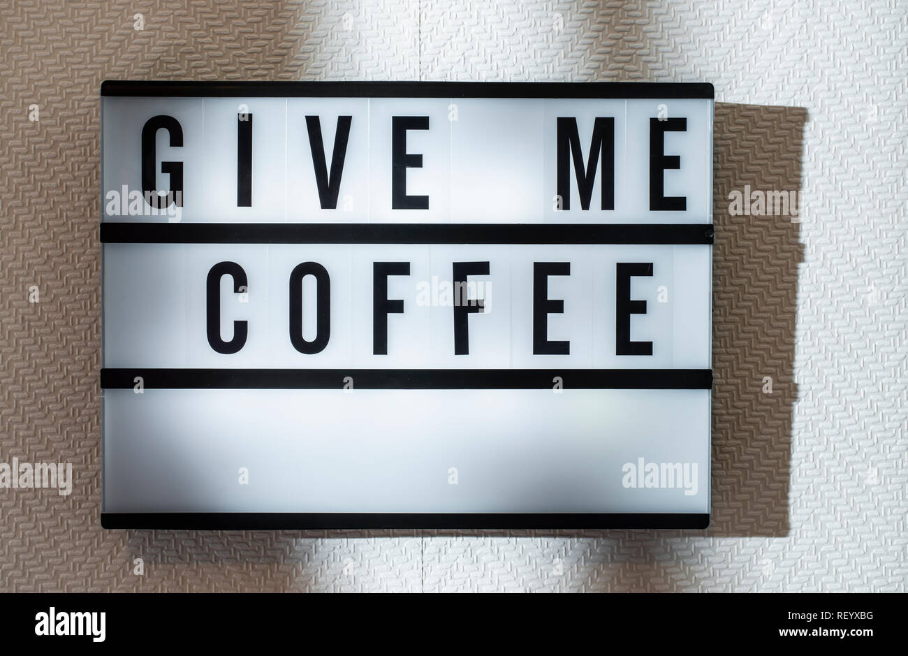 Message Give Me Coffee on illuminated board. Coffee drinking concept ...