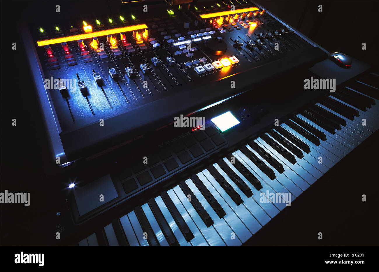 Closeup view on small modern home music studio, keyboard, mixing ...