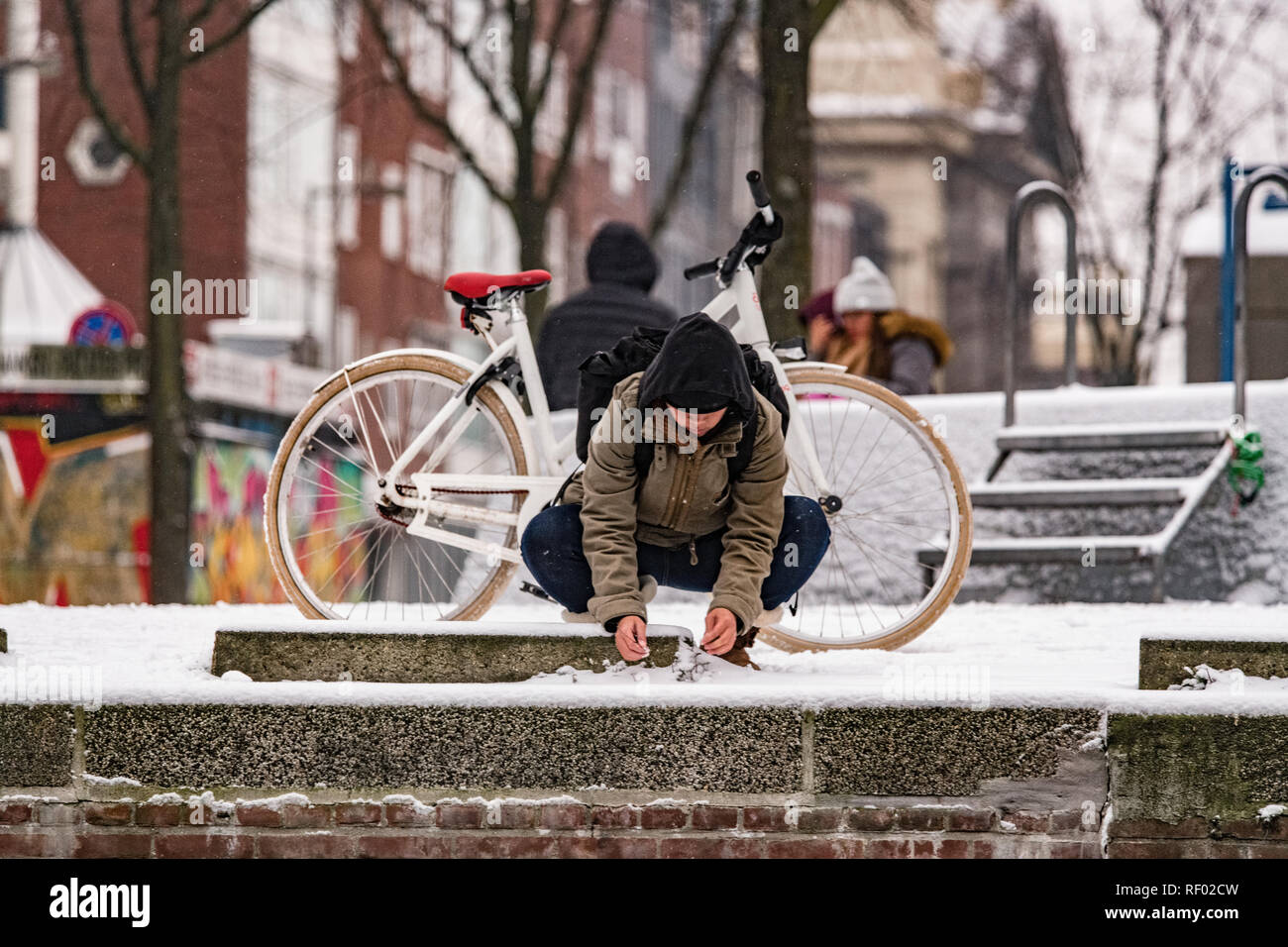 Amsterdam, Netherlands boy making snow ball Stock Photo - Alamy