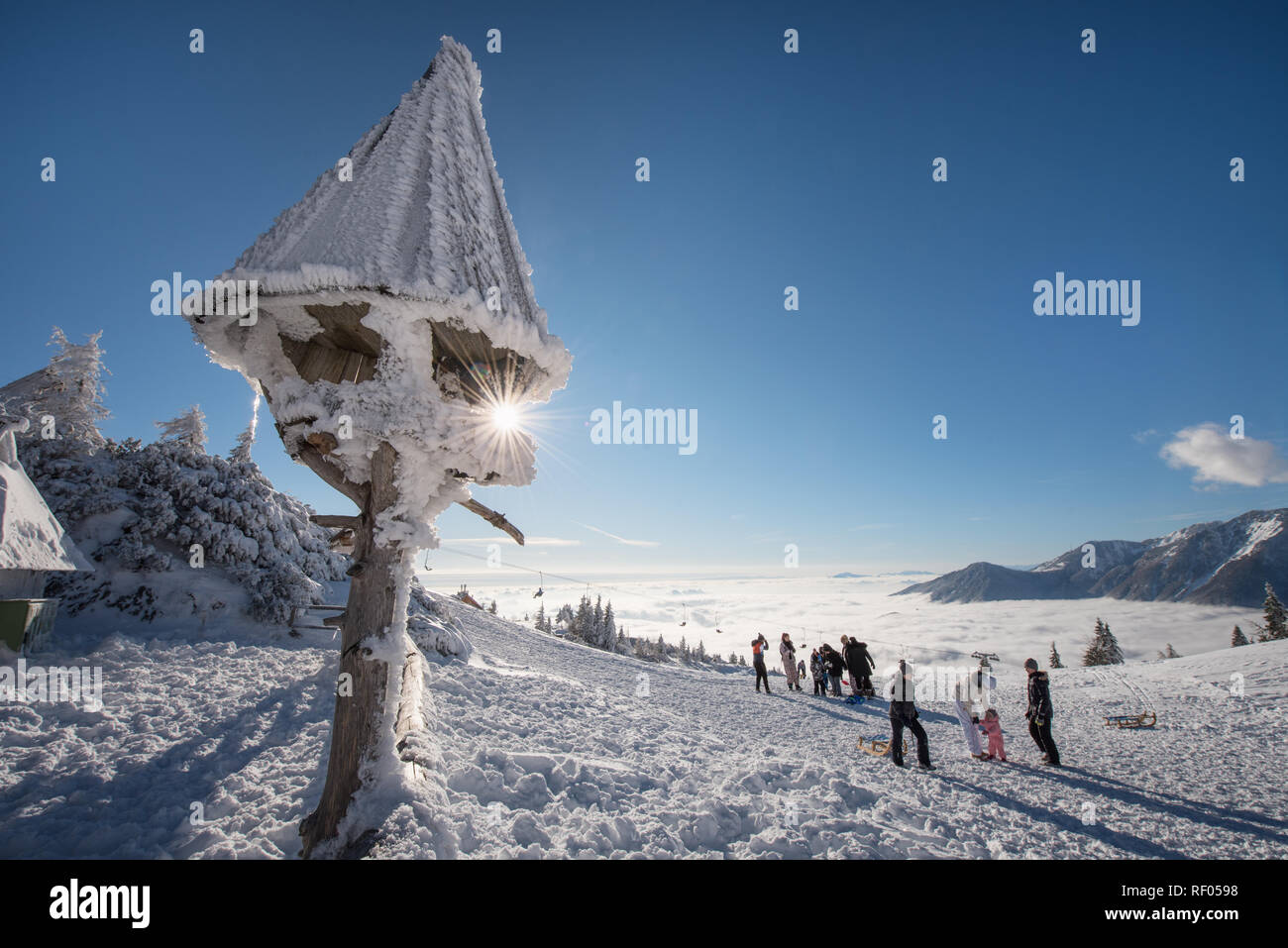 People having fun on a sunny winter Sunday in Velika Planina, Slovenia ...