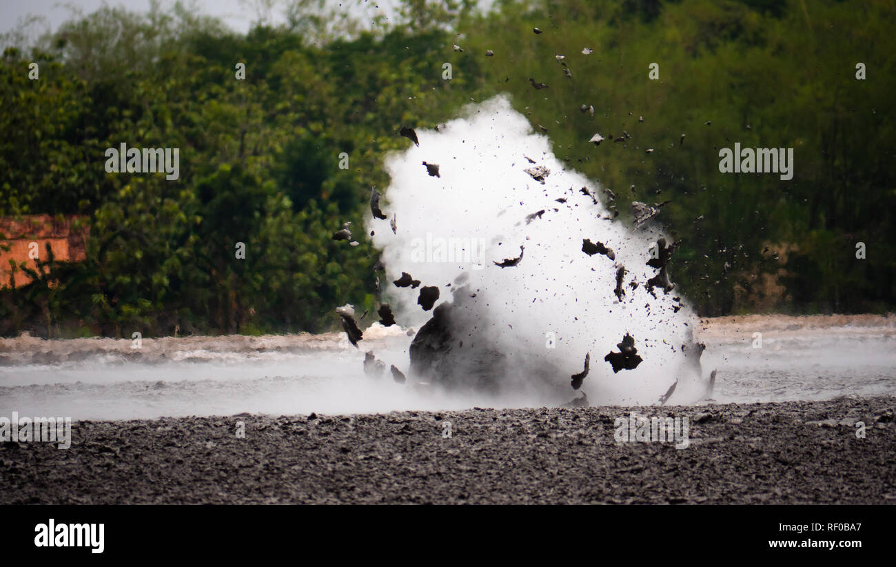 mud volcano with bursting bubble bledug kuwu. volcanic plateau with ...