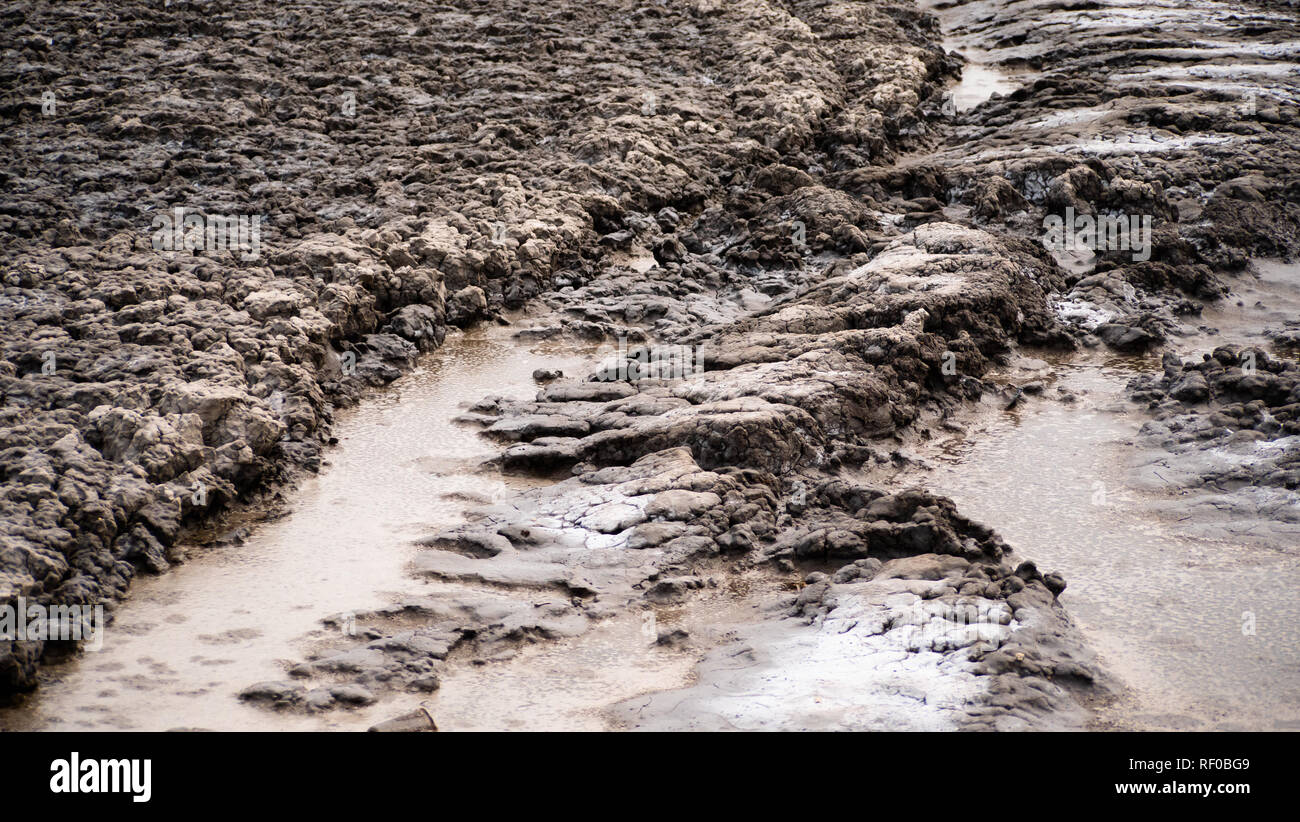 Dry cracked soil, Arid climate. Volcanic landscape around volcano ...