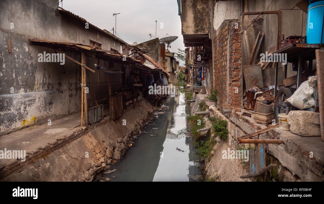 Poor area with slums and sewers in Indonesia. Poor asian city block ...