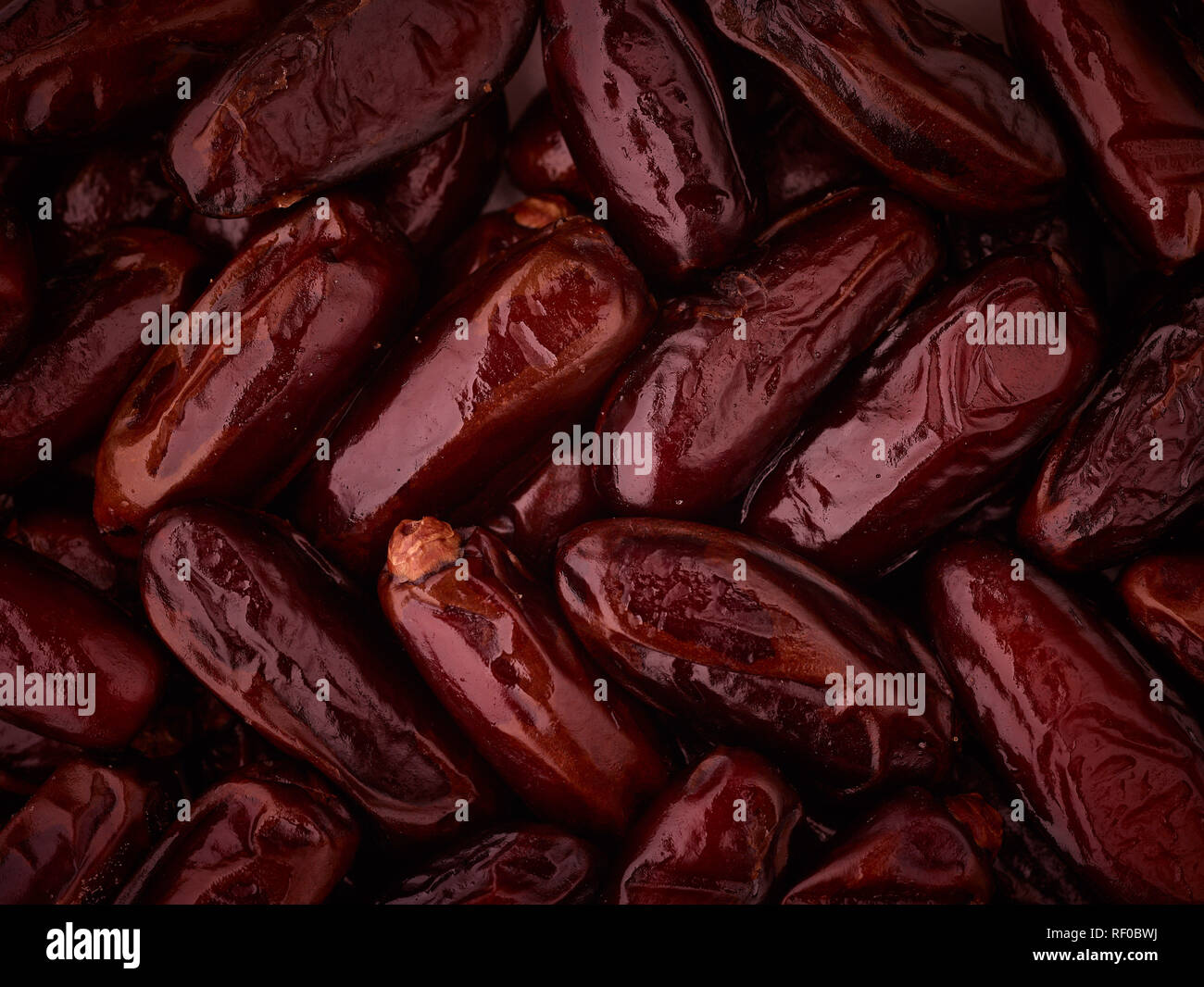 Date fruit with date pick , food still-life photograph Stock Photo - Alamy