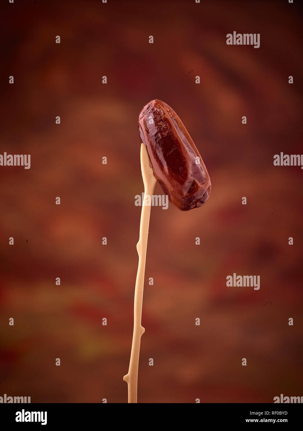 Date fruit with date pick , food still-life photograph Stock Photo - Alamy