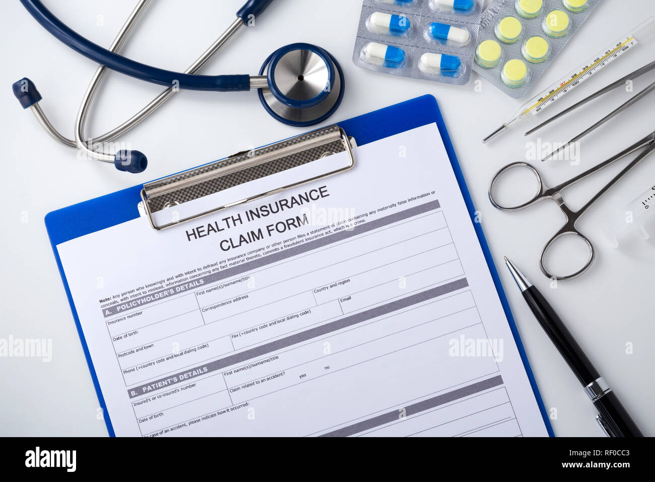 Health insurance form with pen on doctor desk, top view Stock Photo - Alamy