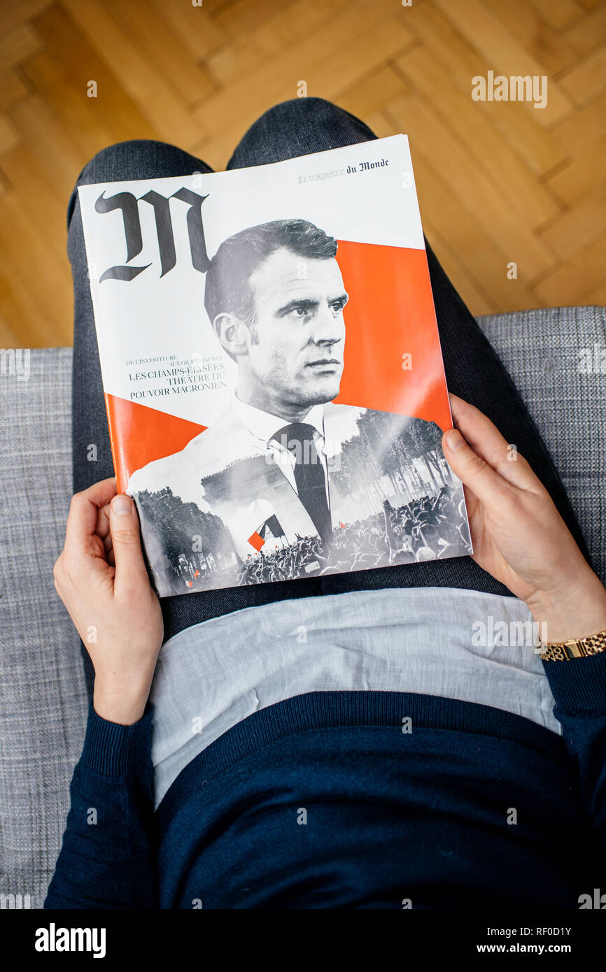 Paris, France - Jan 2, 2019: View from above of french woman reading M ...