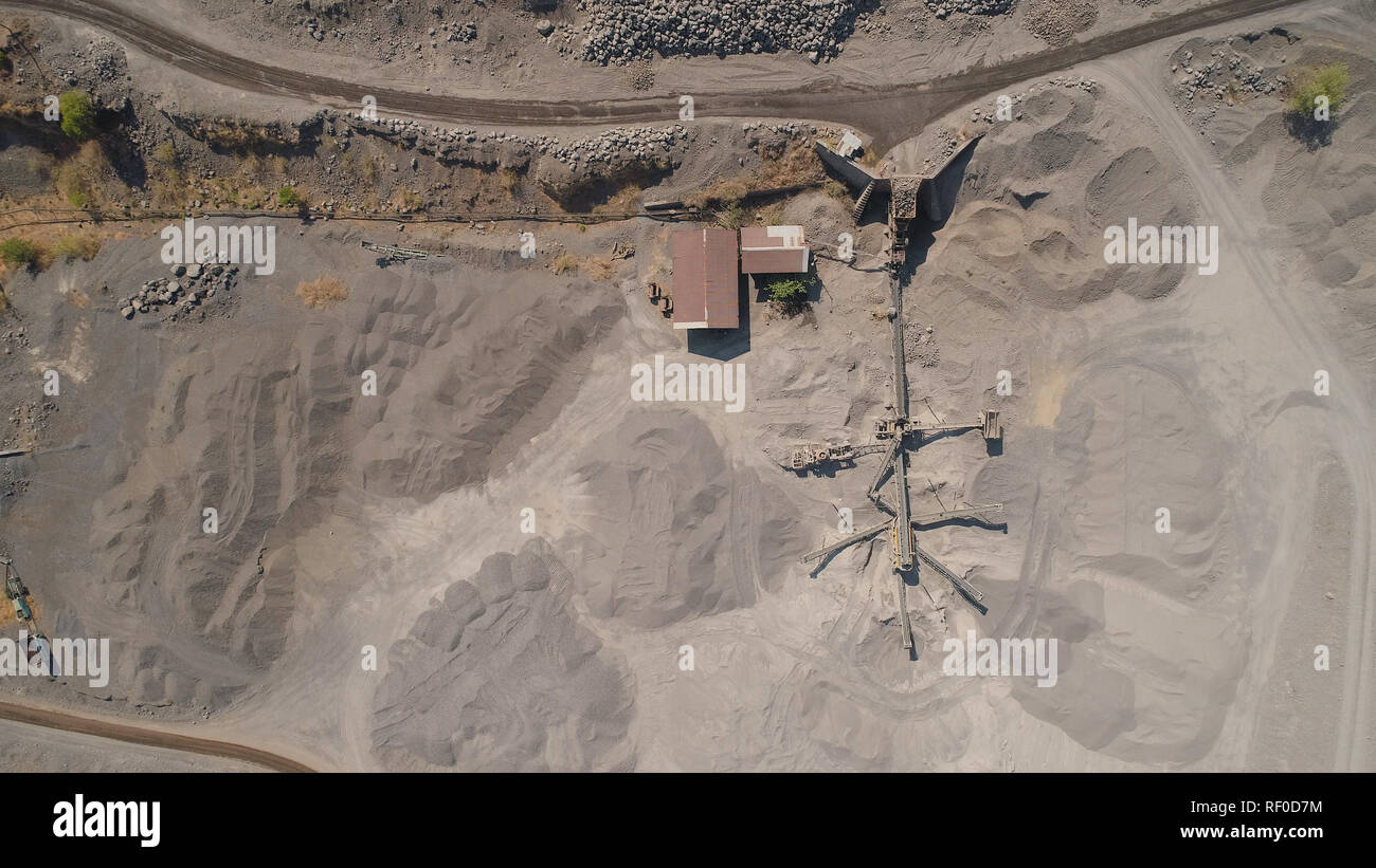 Heavy machinery at gravel and sand quarry. extraction volcanic sand at ...