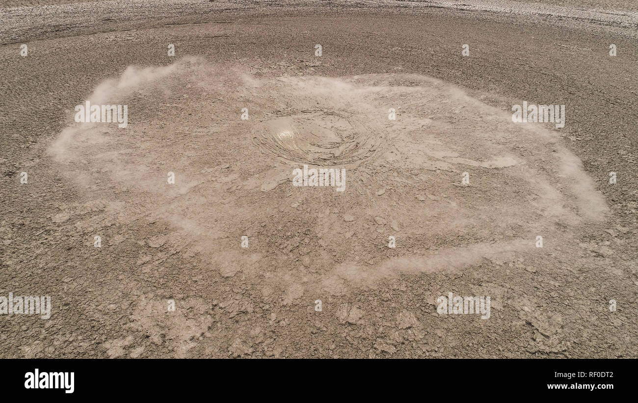 Mud volcano with bursting bubble bledug kuwu. aerial view volcanic ...