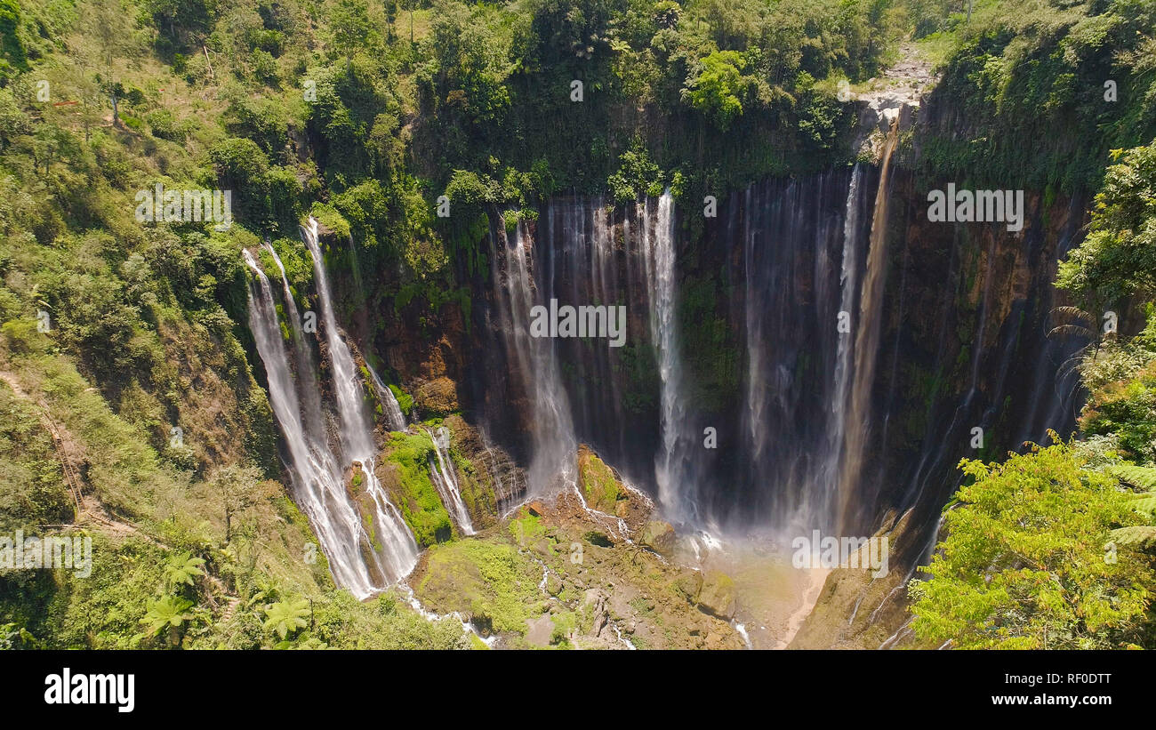 beautiful waterfall Coban Sewu in tropical forest, Java Indonesia ...
