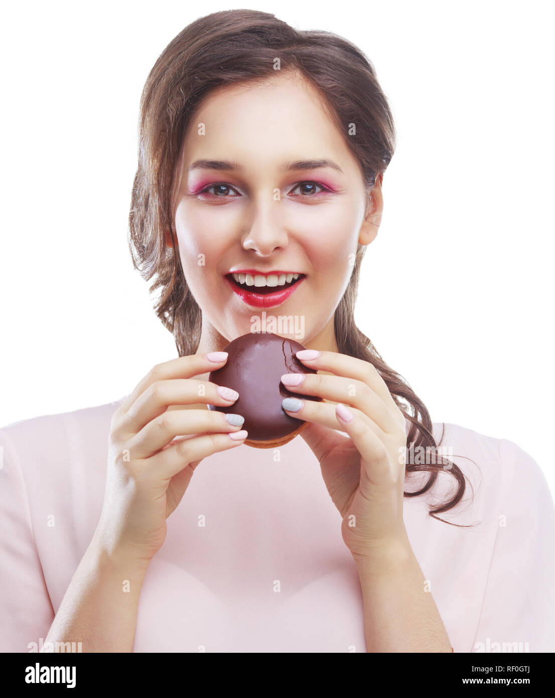 beautiful young model eating dessert, isolated against white background ...