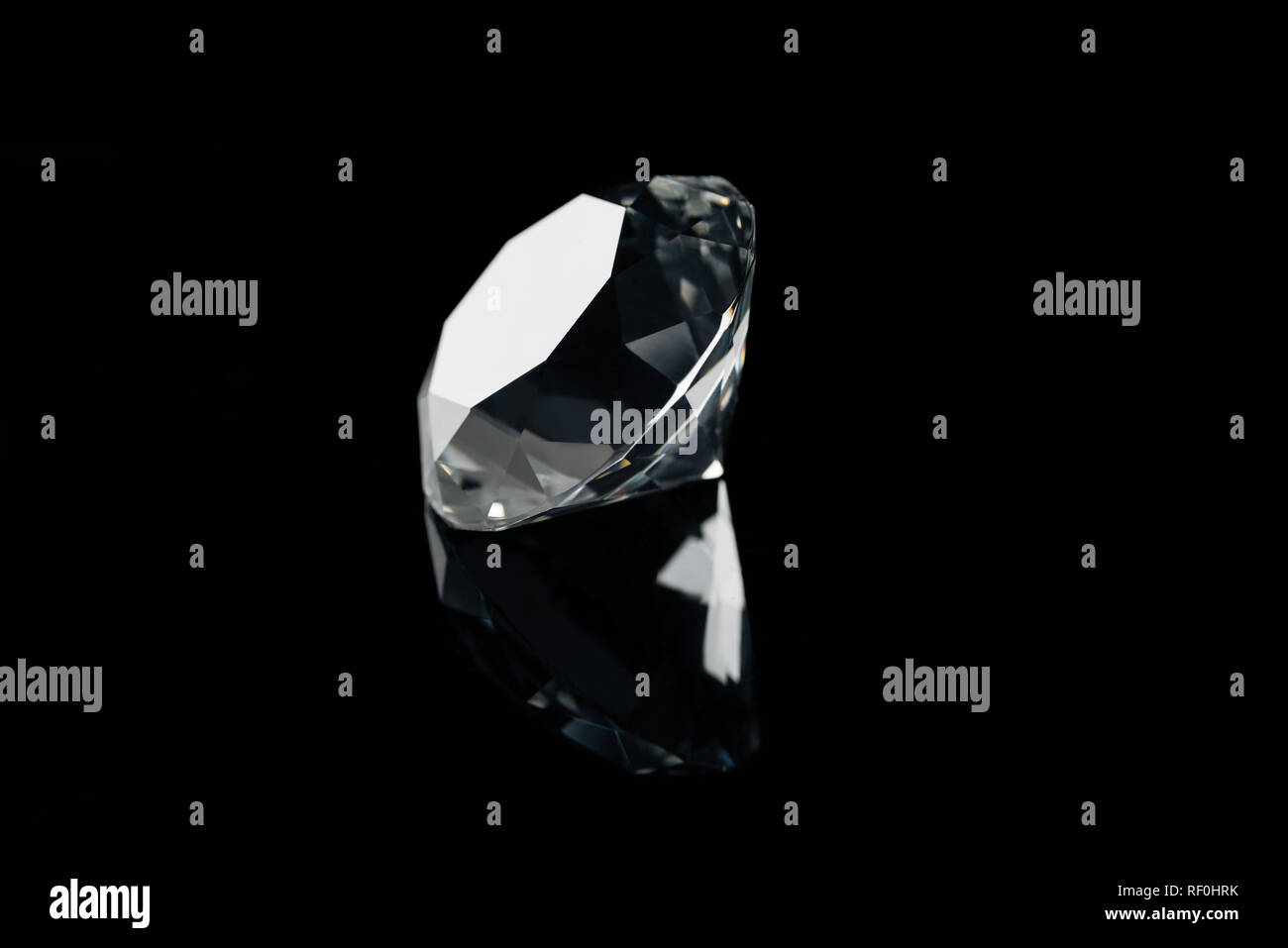 pure shiny diamond with reflection isolated on black Stock Photo - Alamy