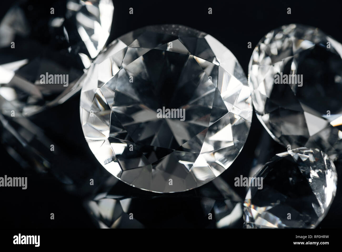 collection of pure shiny diamonds isolated on black Stock Photo - Alamy