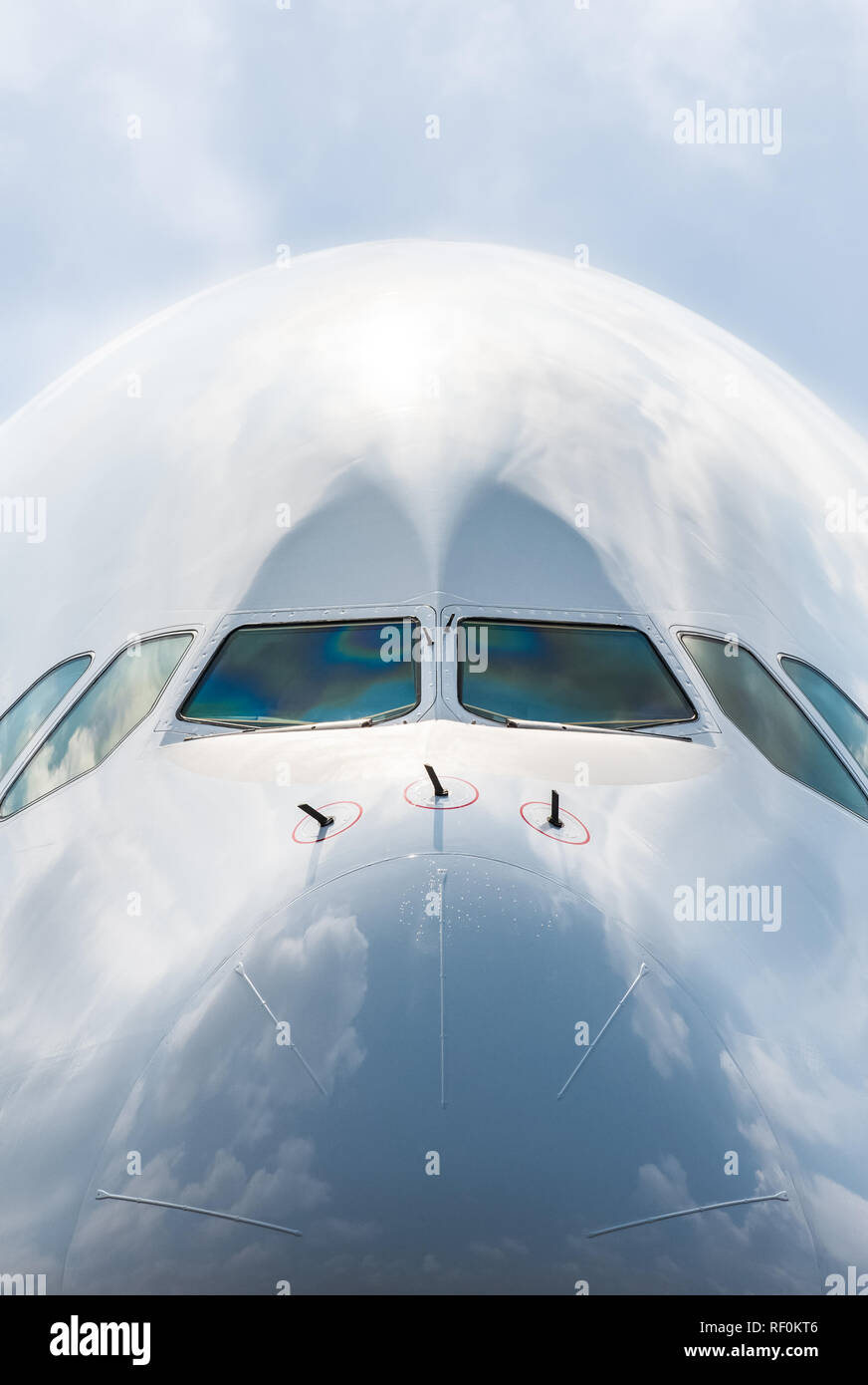 large passenger jet nose cone and cockpit window closeup Stock Photo ...