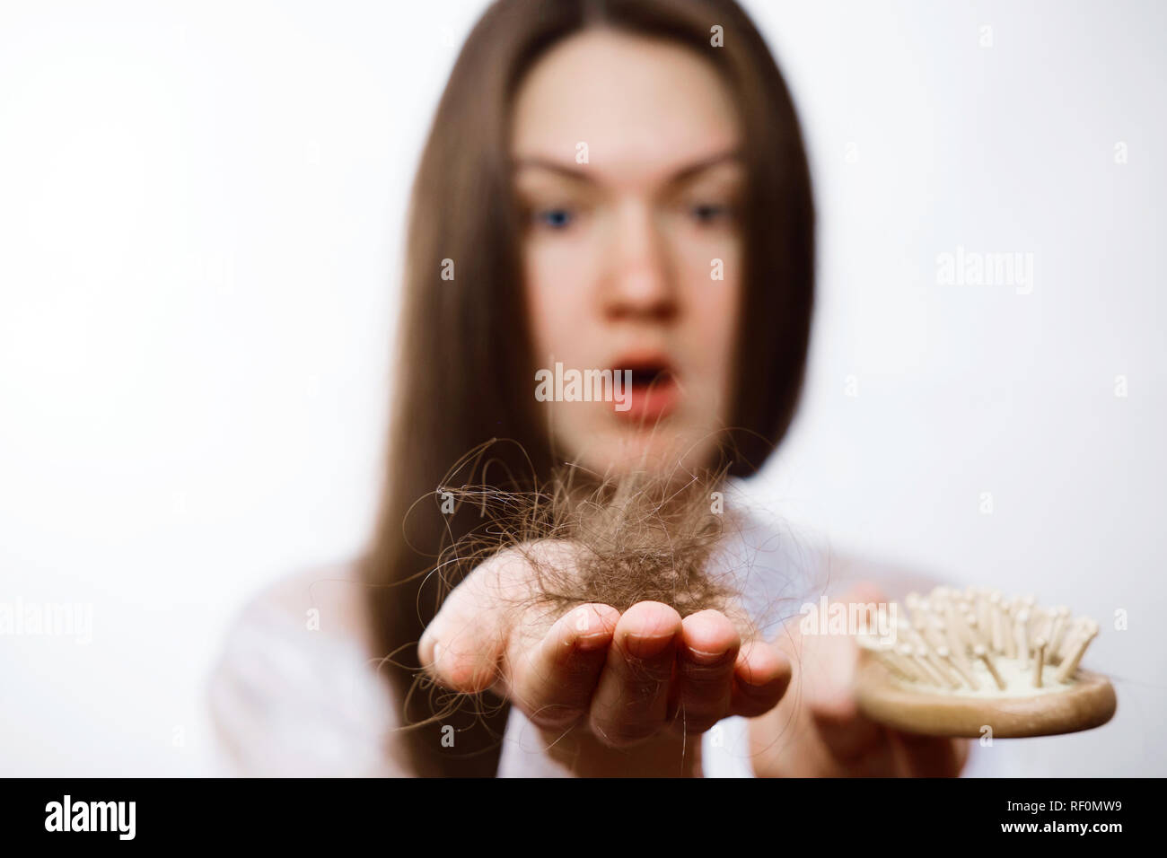 girl with horror look at hair, hair problems brittle hair Stock Photo ...