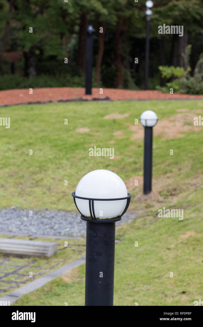 White round shaped garden lights in the daytime at garden Stock Photo ...