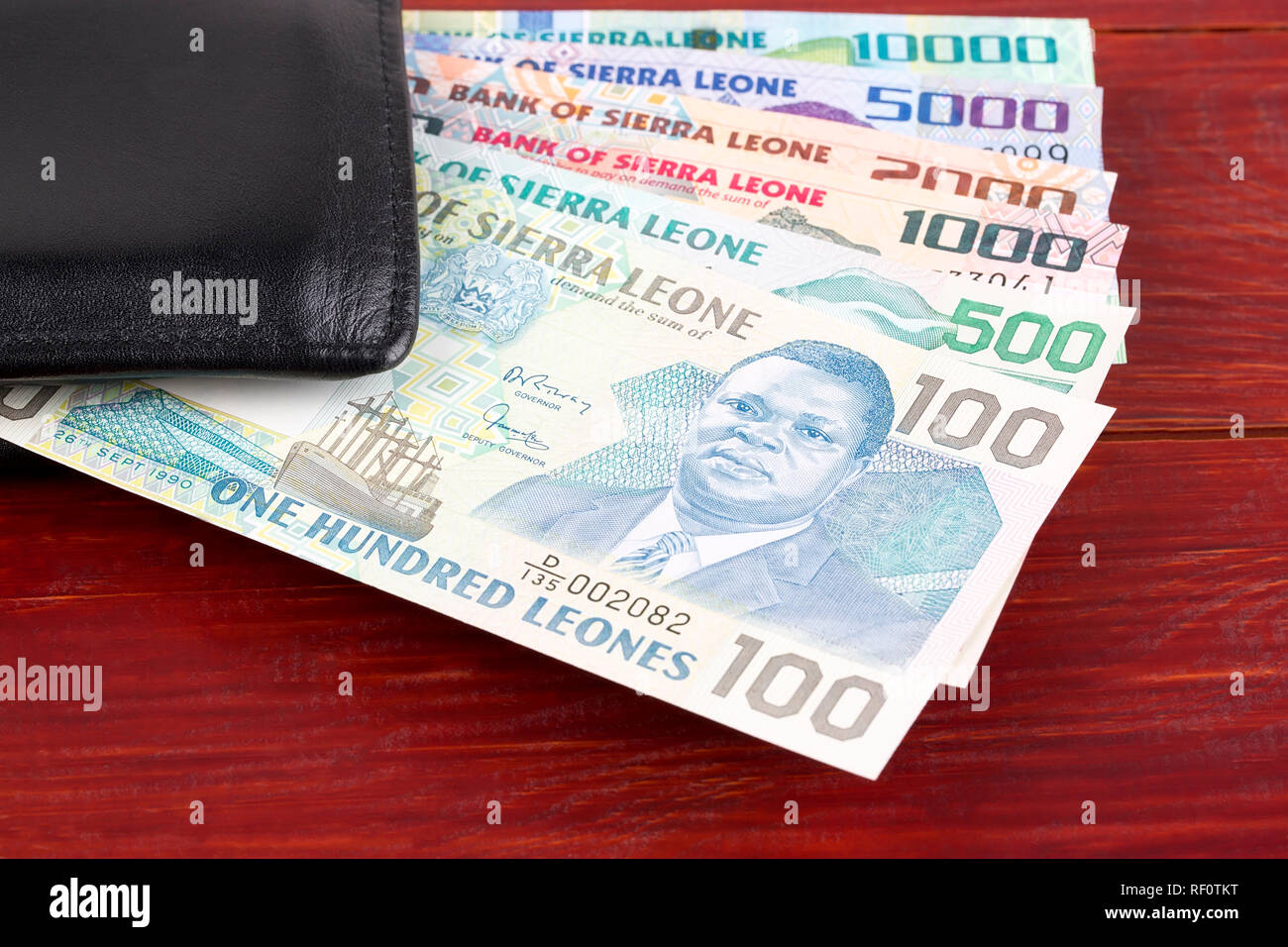 Sierra Leonean money in the black wallet Stock Photo - Alamy