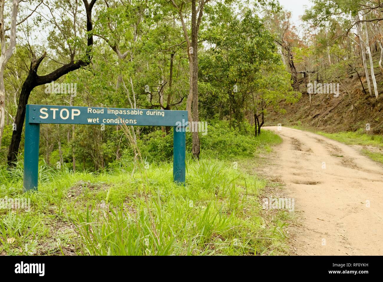 Stop road impassable in wet conditions sign hi-res stock photography ...