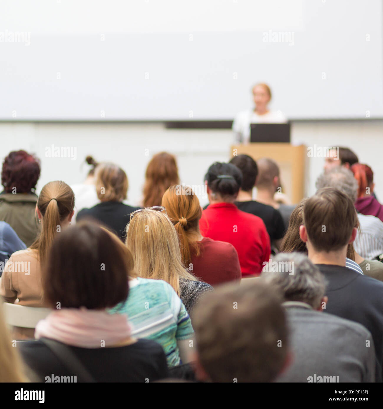Woman giving presentation on business conference Stock Photo - Alamy