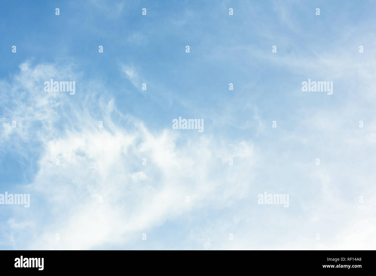 Daytime sky with beautiful colors and light clouds for use as a ...