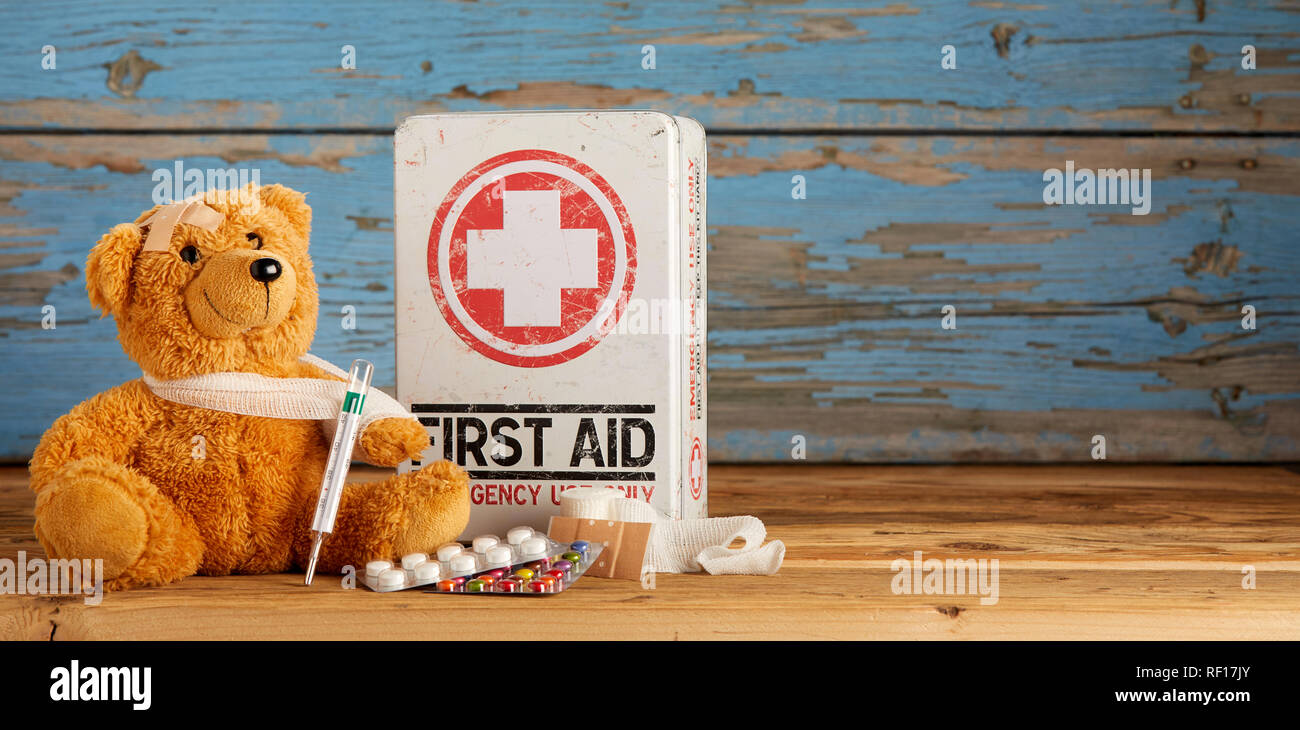 Panoramic banner of a cute little teddy bear with its arm in a sling ...