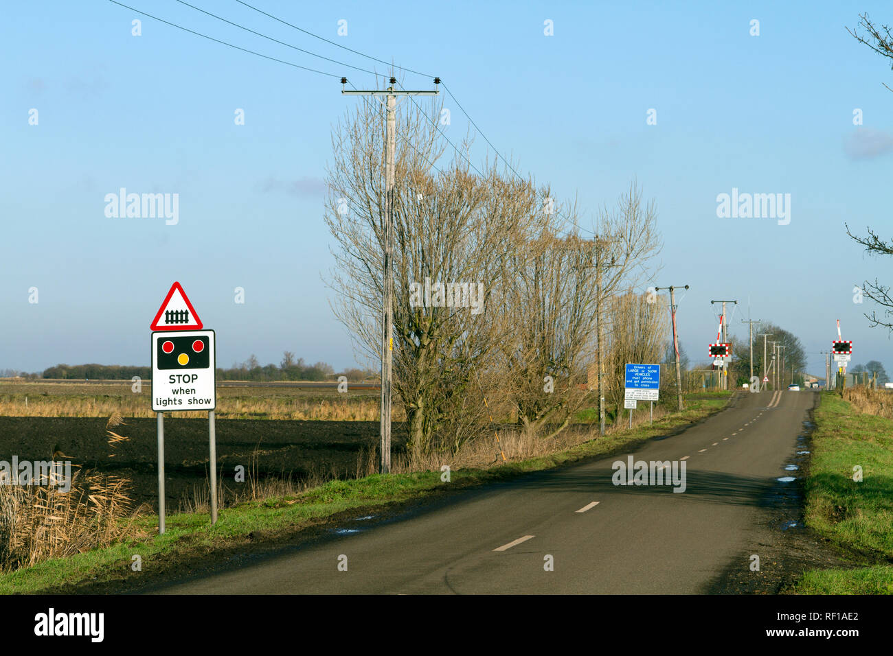 Railway level crossing on Wisbeach Road near Manea Cambridgeshire Stock ...
