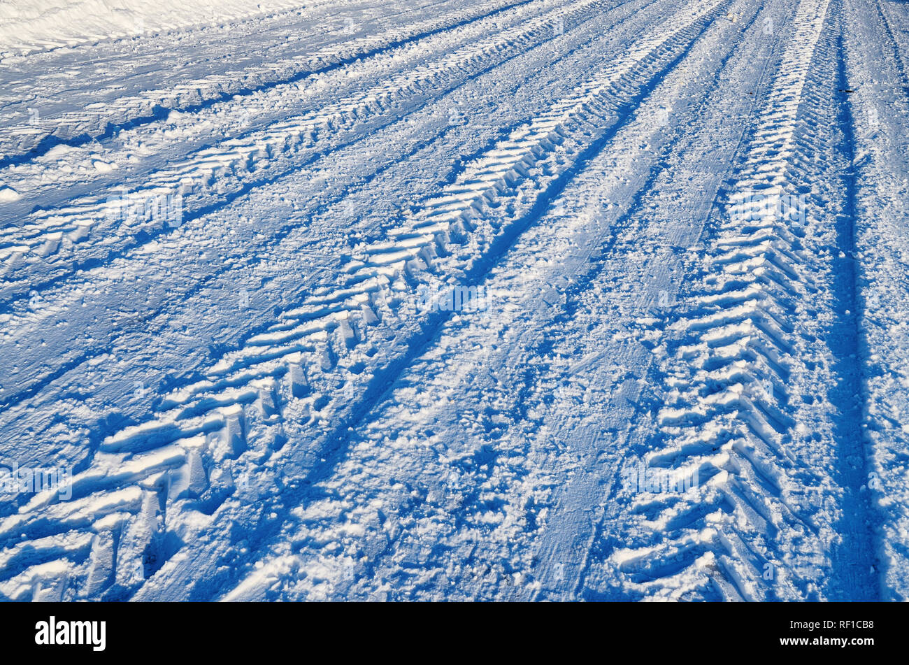 Car tire tread on snow.They create a special pattern Stock Photo - Alamy