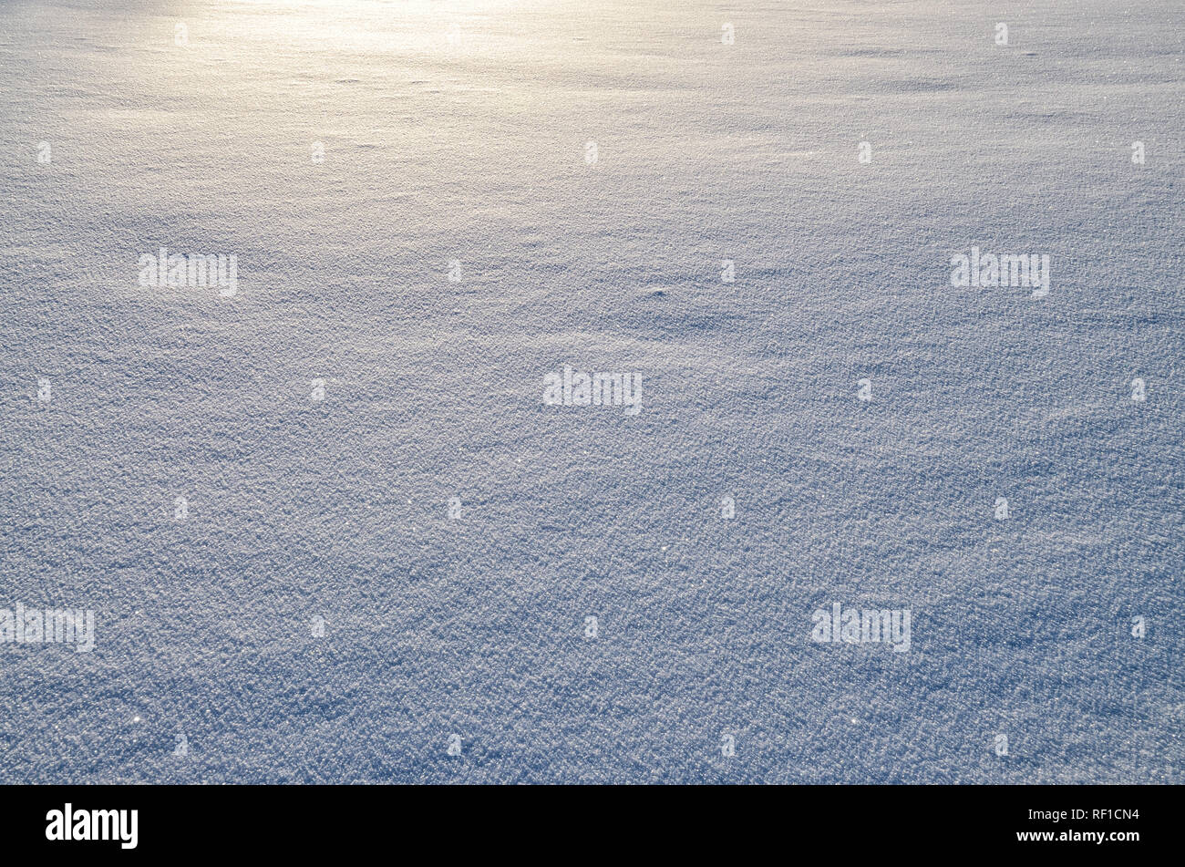 Slanting rays of the sun showing the texture of snow Stock Photo - Alamy
