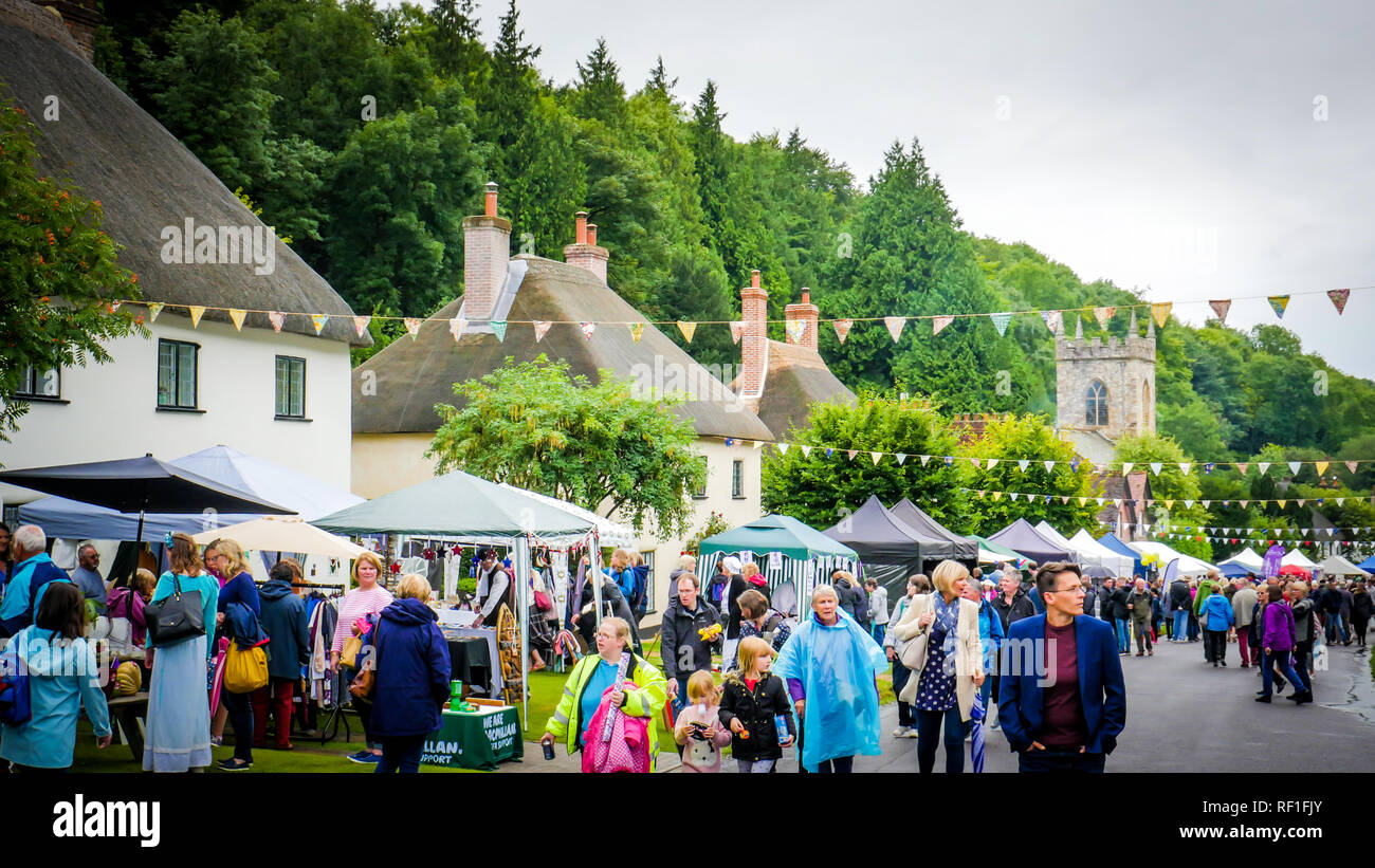 Milton Abbas / UK - July 29 2017: People are walking down the street in ...