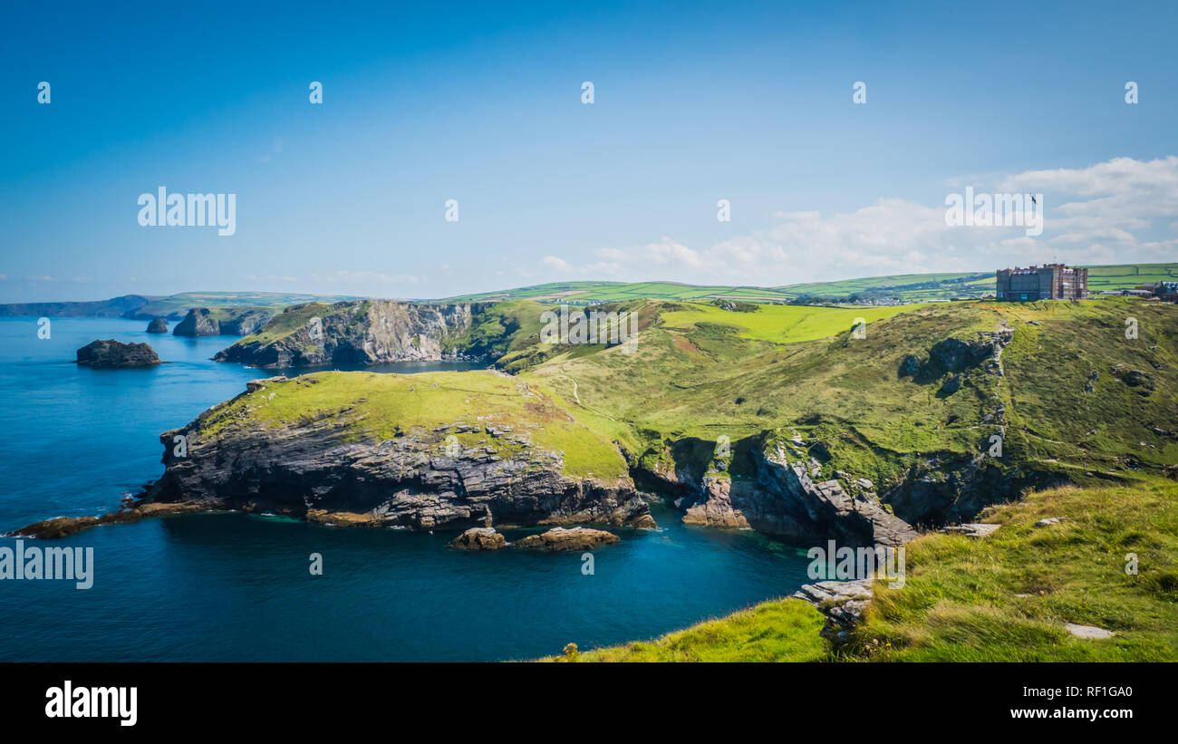 Merlin's Cave, green rocky cliffs, dramatic landscape with Atlantic ...
