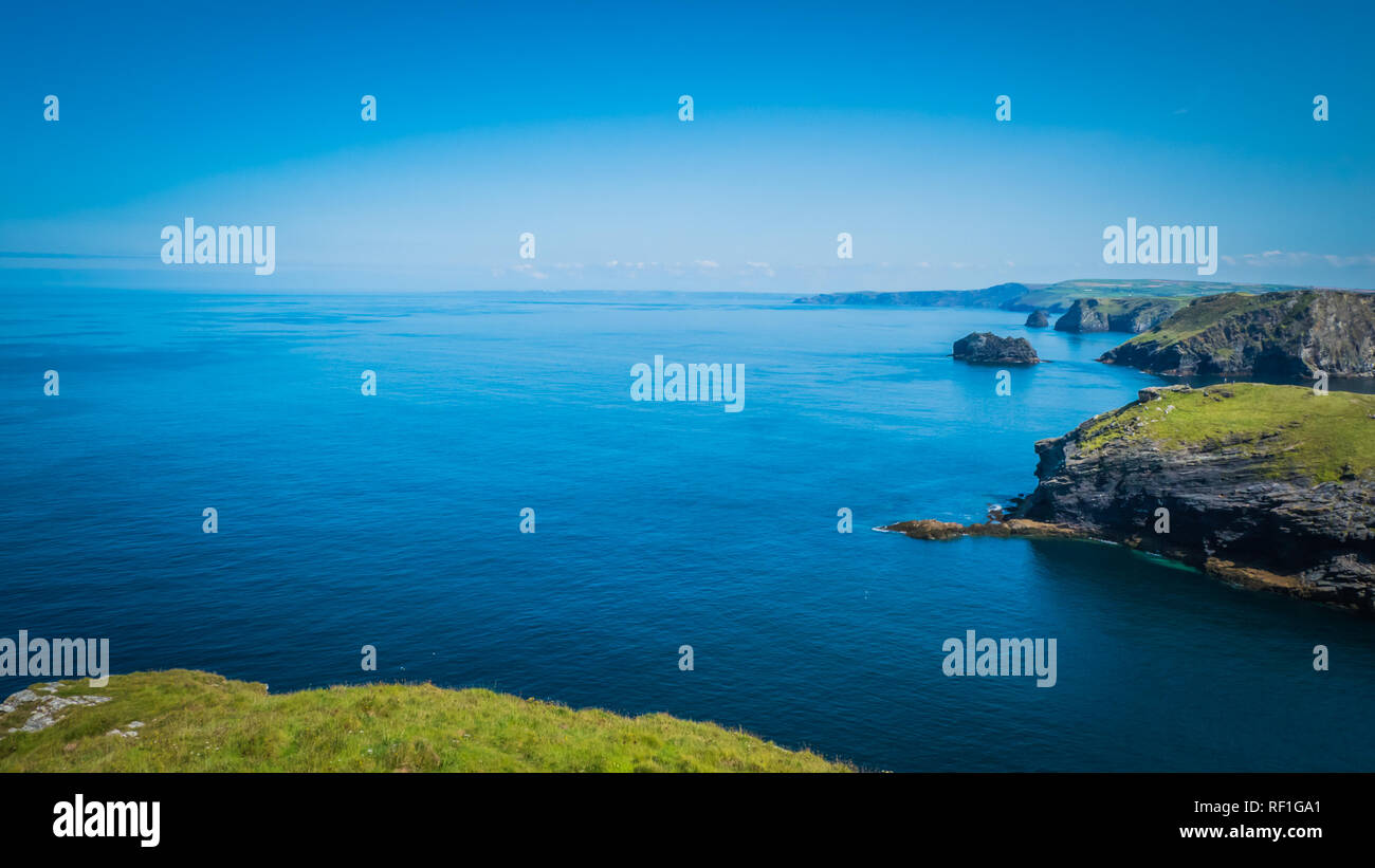 Green rocky cliffs, dramatic landscape with Atlantic Ocean / Celtic Sea ...