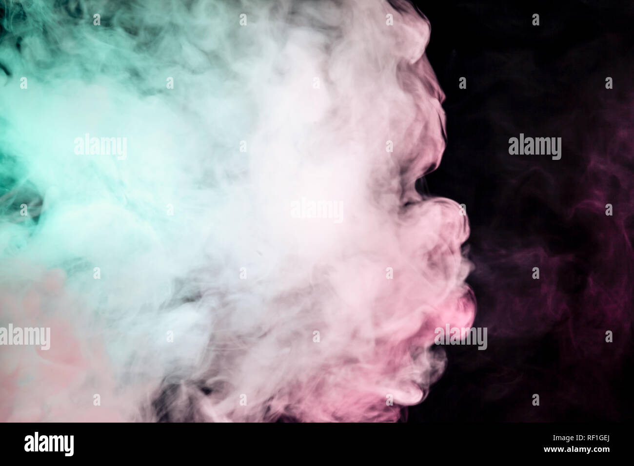 Multicolor, thick smoke, illuminated by colored in green and pink light ...