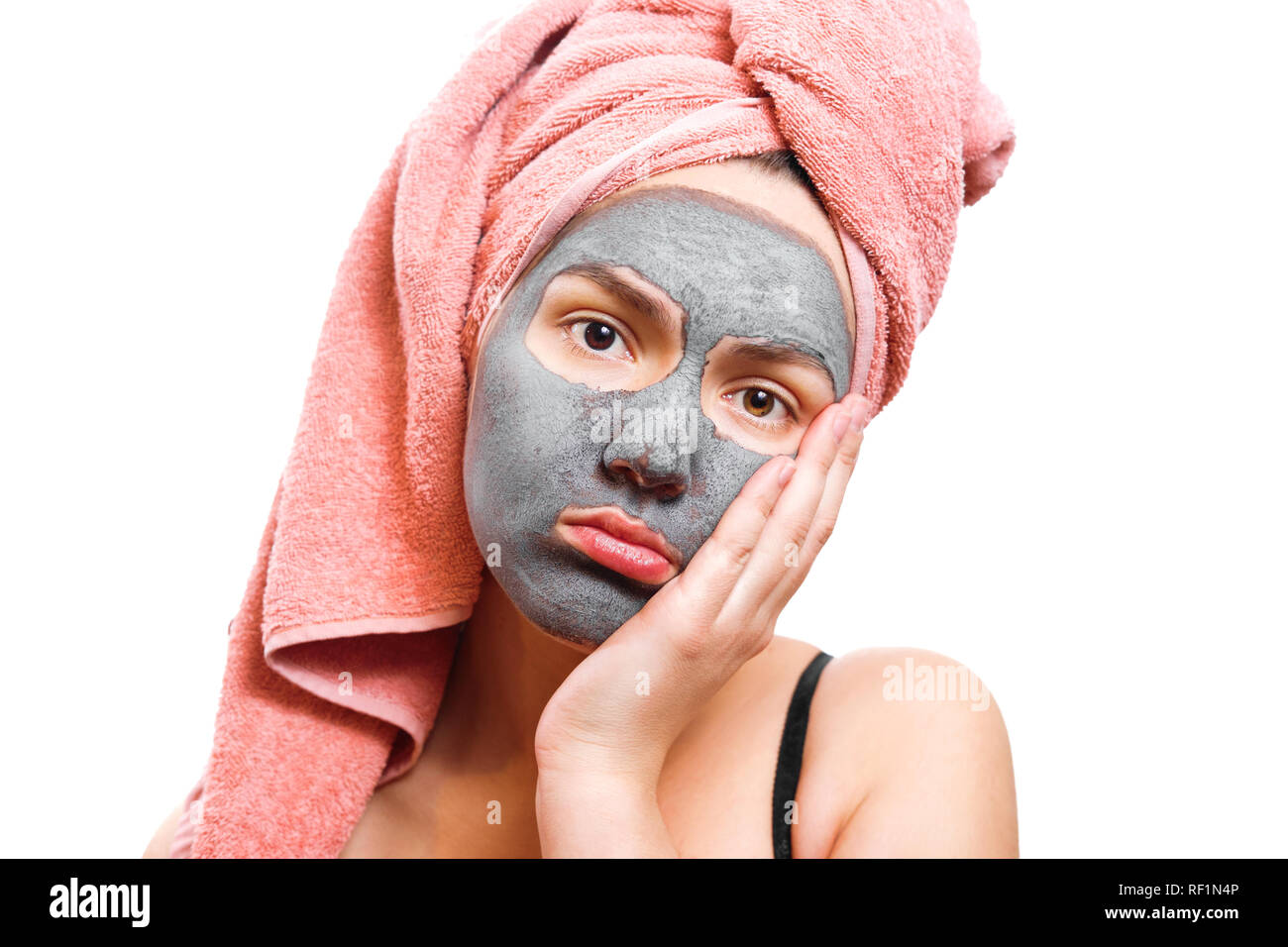 serious sad young woman wait in mask for face skin on isolated white ...