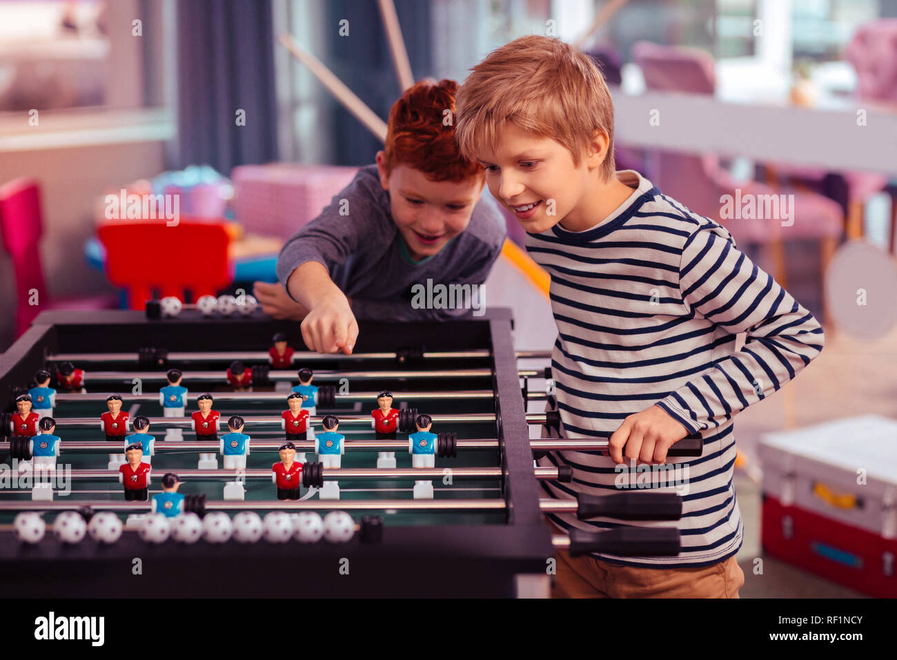 Kids playing game table hi-res stock photography and images - Alamy