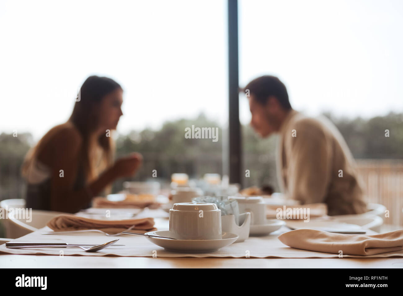 Romantic couple eating breakfast together at the hotel Stock Photo - Alamy