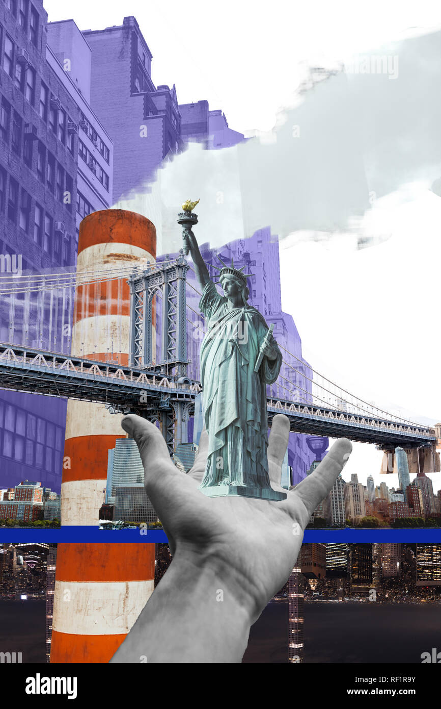 partial view of male hand with statue of Liberty and new york city on ...