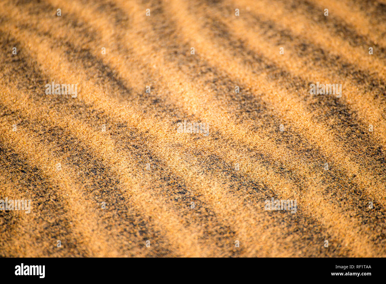 Sand of a beach with patterns Stock Photo - Alamy