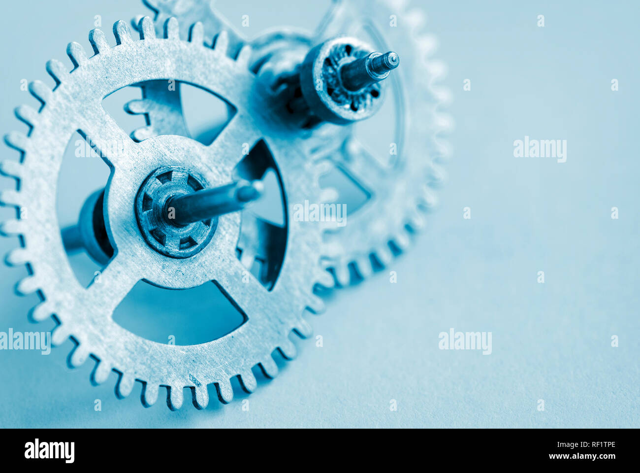 Small gears on grey hi-res stock photography and images - Alamy