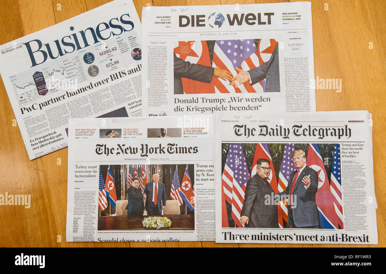 PARIS, FRANCE - JUNE 13, 2018: International newspapers with cover U.S ...