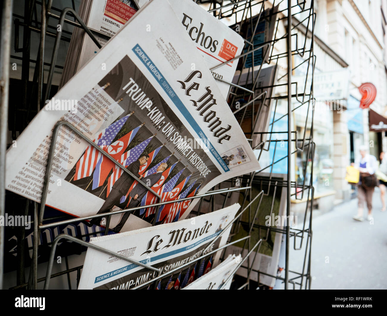 PARIS, FRANCE - JUNE 13, 2018: City background and Le Monde newspaper ...