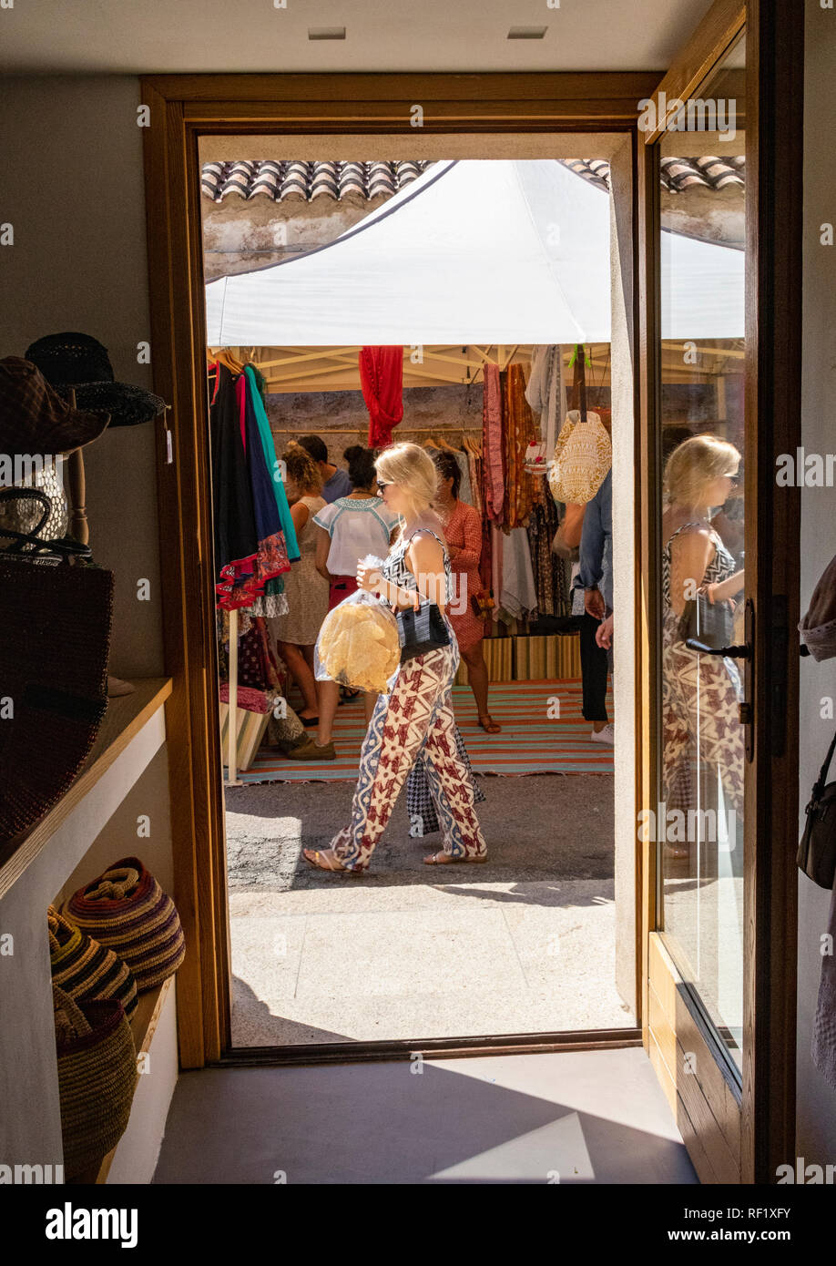 Open Door: Looking Out from an Open Women’s Clothes Shop Door with ...