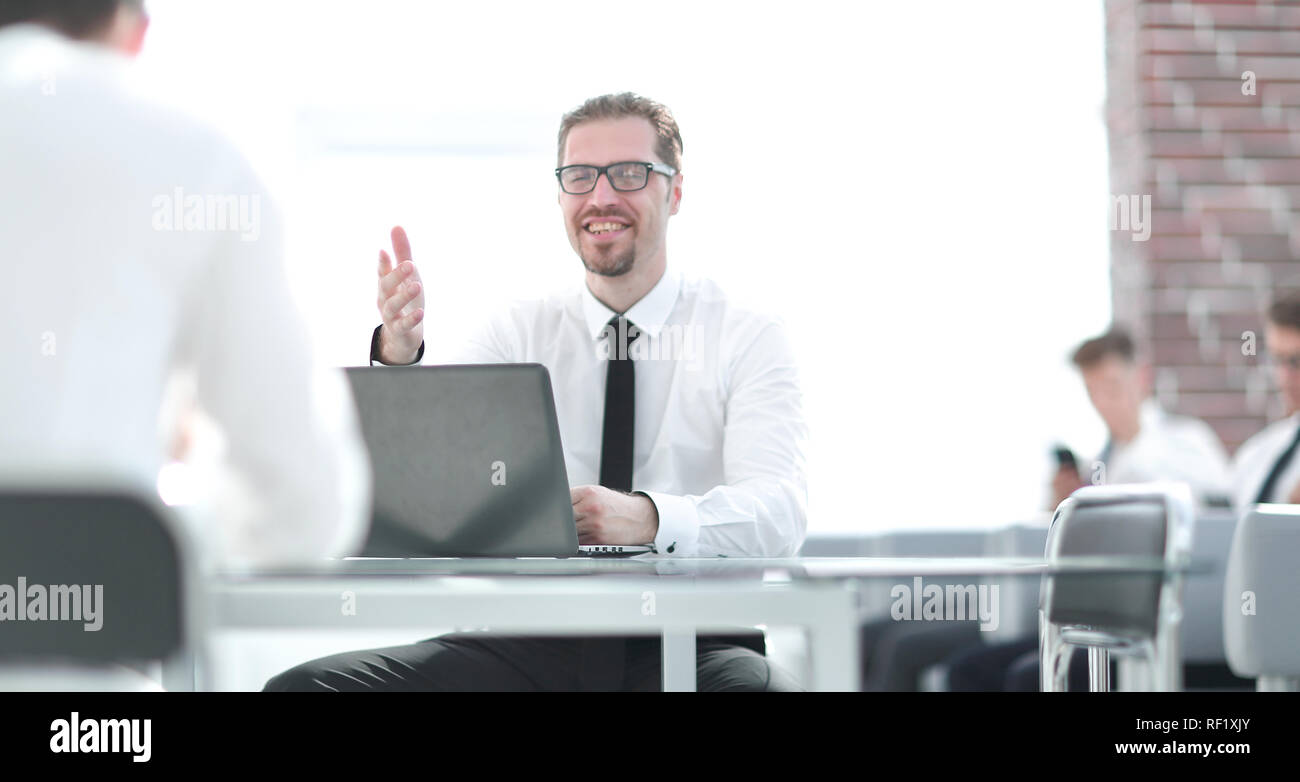 employee talking with a colleague in the workplace in the office Stock ...